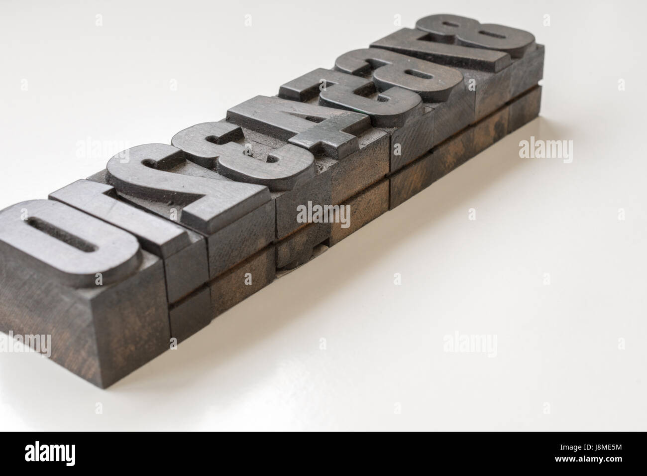 Old letterpress printing block isolated on a white background Stock ...