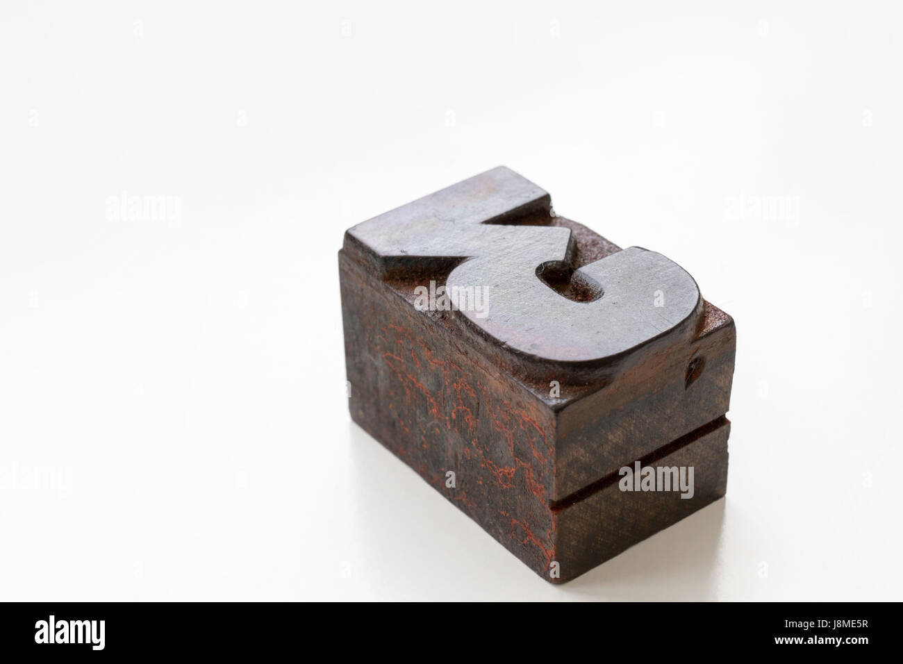 Old letterpress printing block isolated on a white background Stock ...