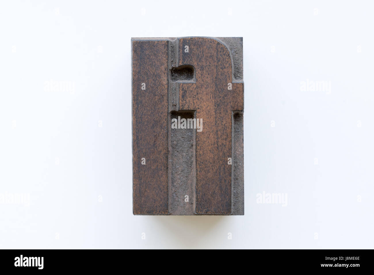 Old letterpress printing block isolated on a white background Stock ...