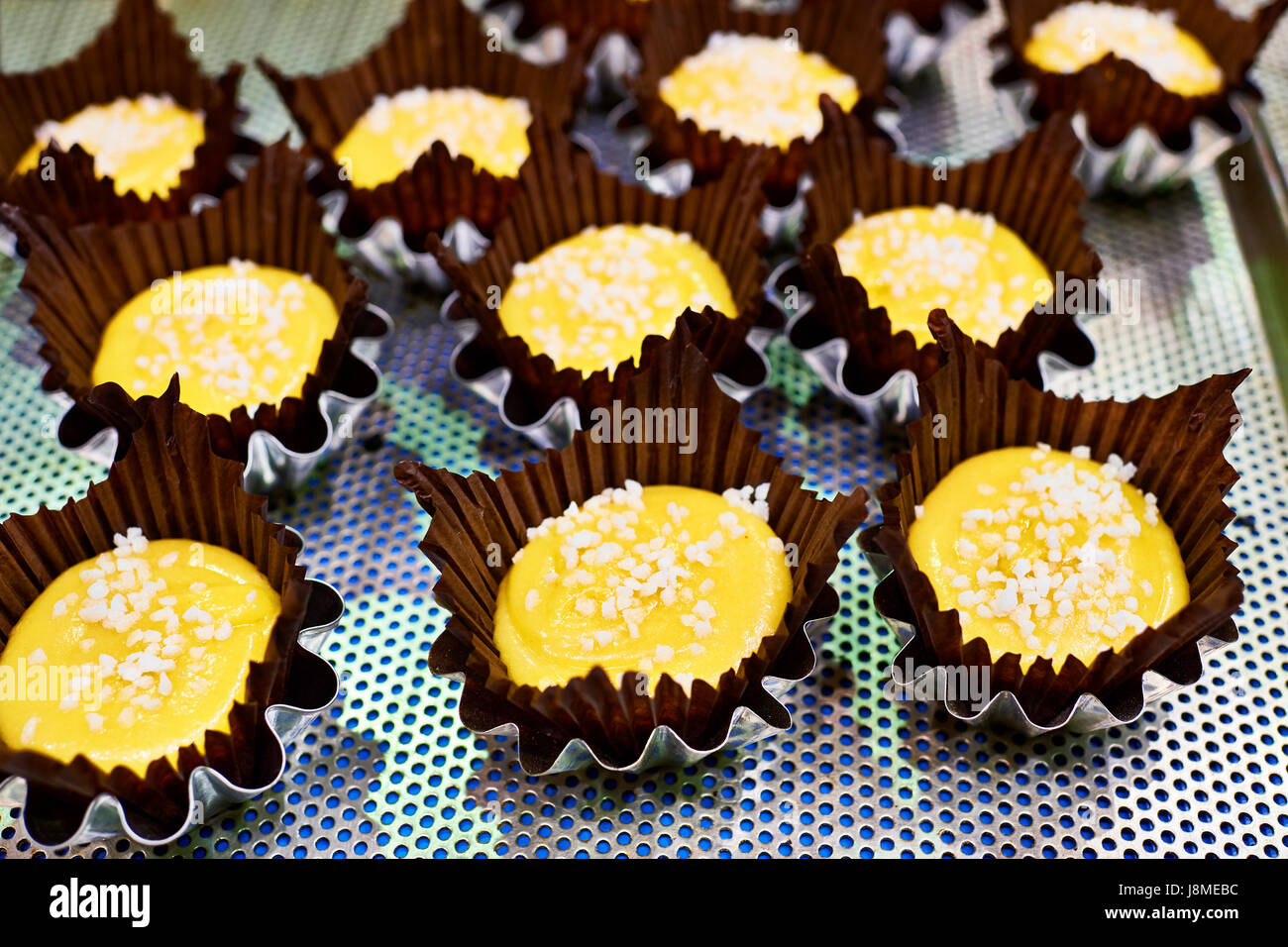Prepared dough into paper muffin forms closeup Stock Photo - Alamy