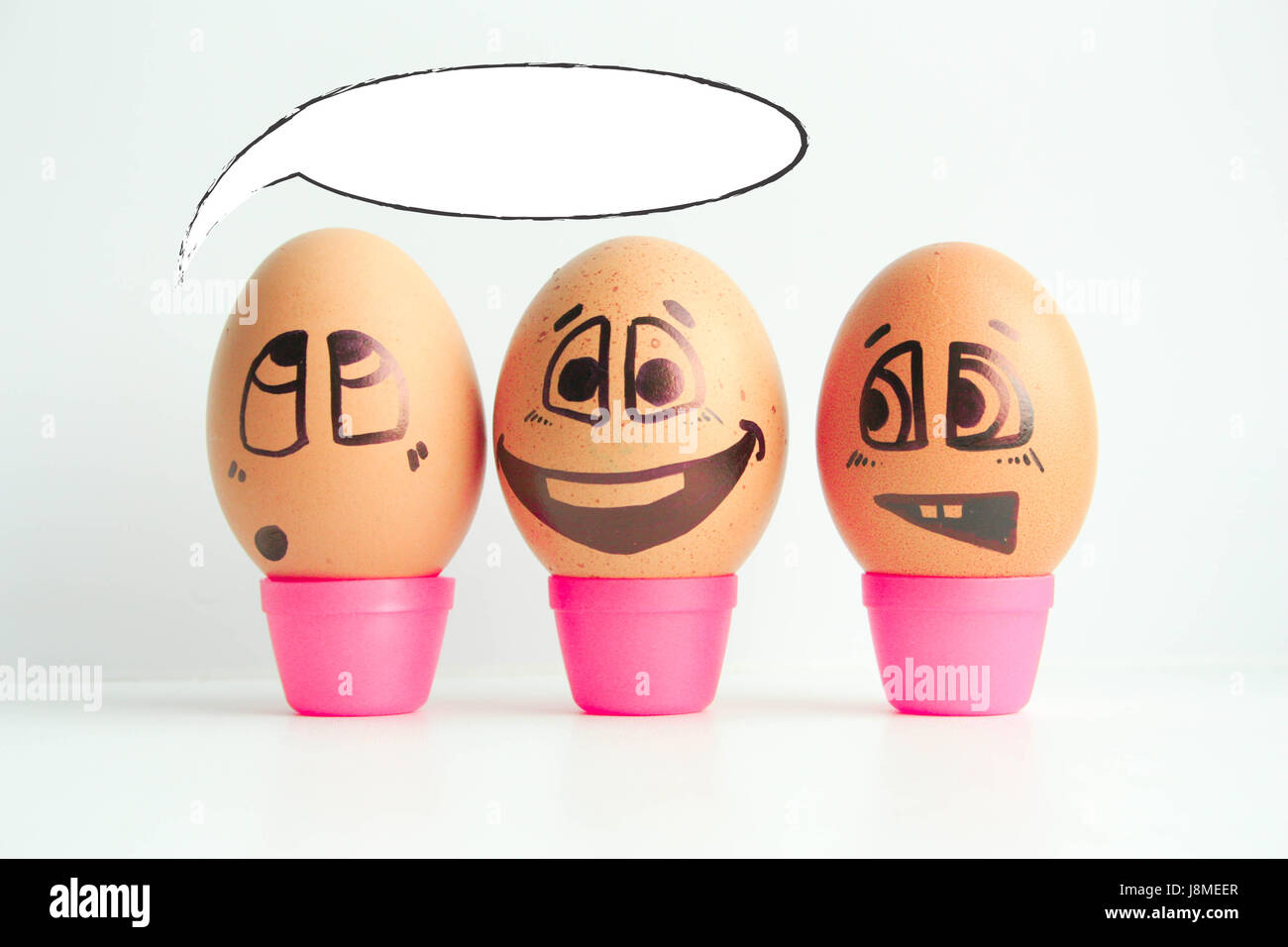 Cheerful eggs three friends, brown eggs. Thinking out loud. Place under ...