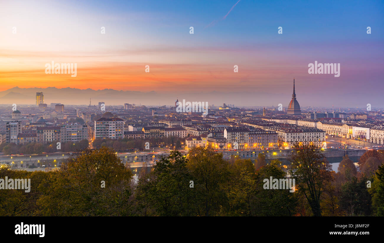 Cityscape of Torino (Turin, Italy) at dusk with colorful moody sky. The ...