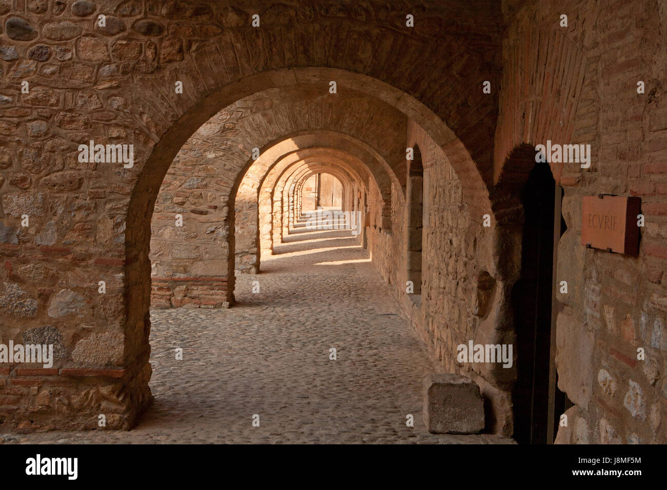 A corridor of stone arches Stock Photo - Alamy