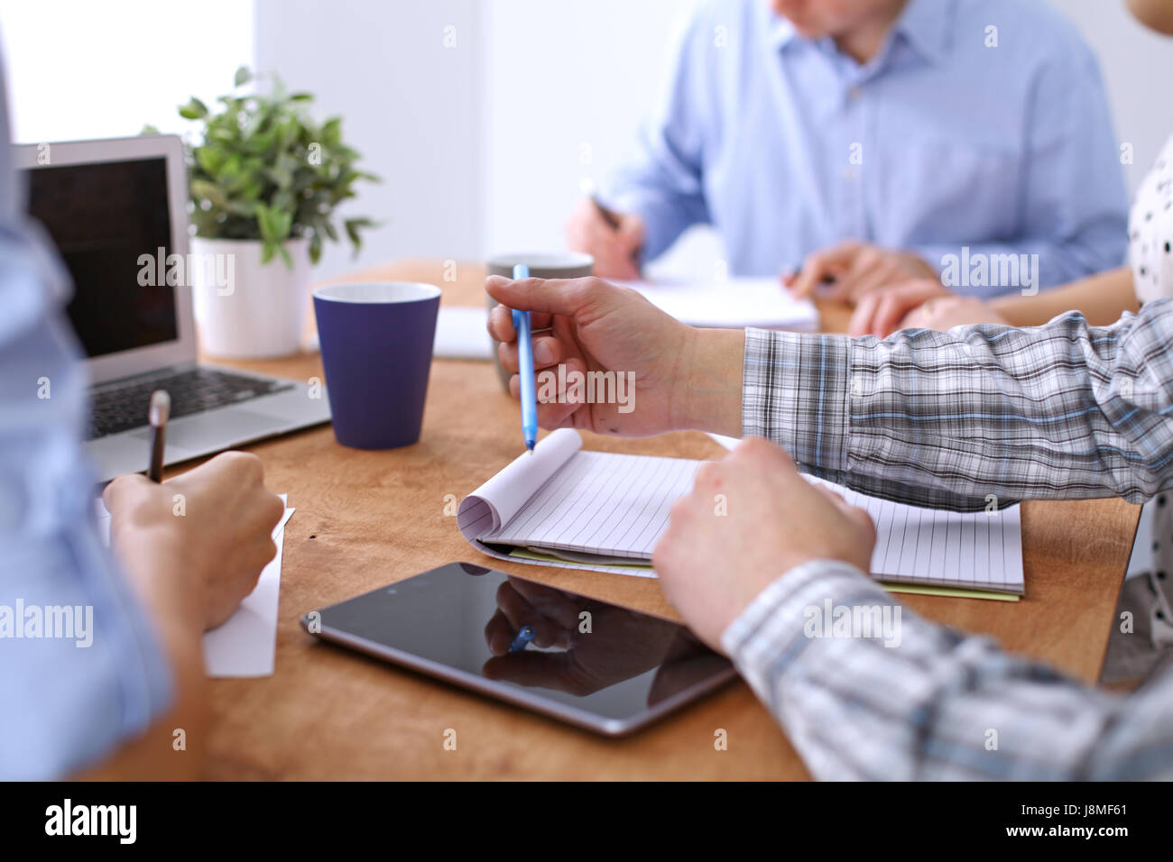 Hands of business people meeting around table Stock Photo - Alamy
