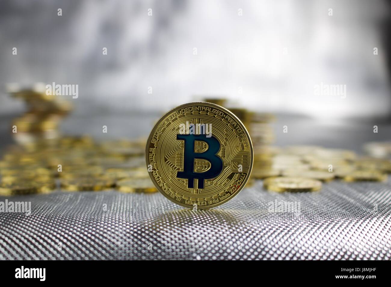 Digital currency physical gold bitcoin coin with a blue sign Stock ...