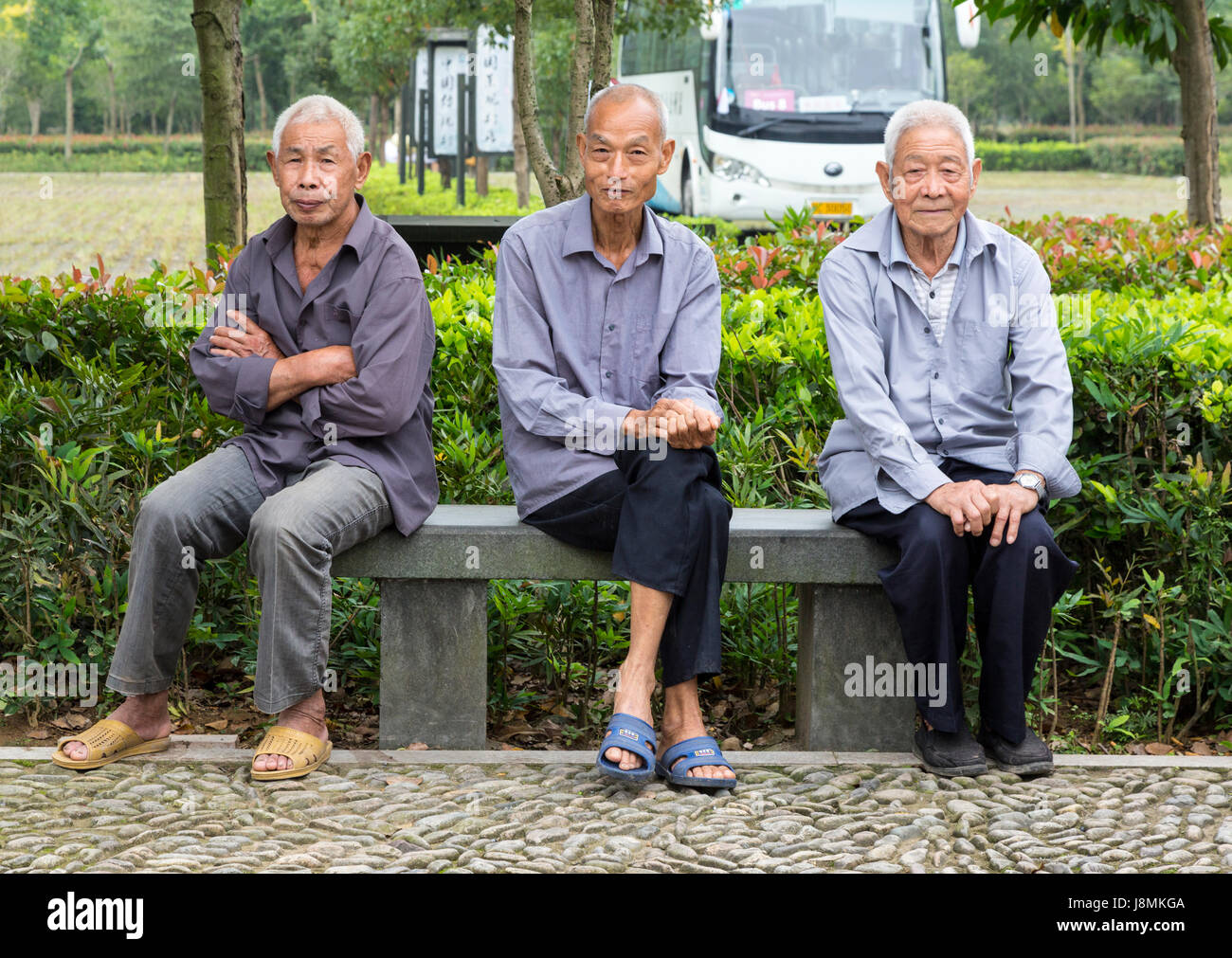Yubei, Zhejiang, China. Three Elderly Men Sitting on a Park Bench Stock ...