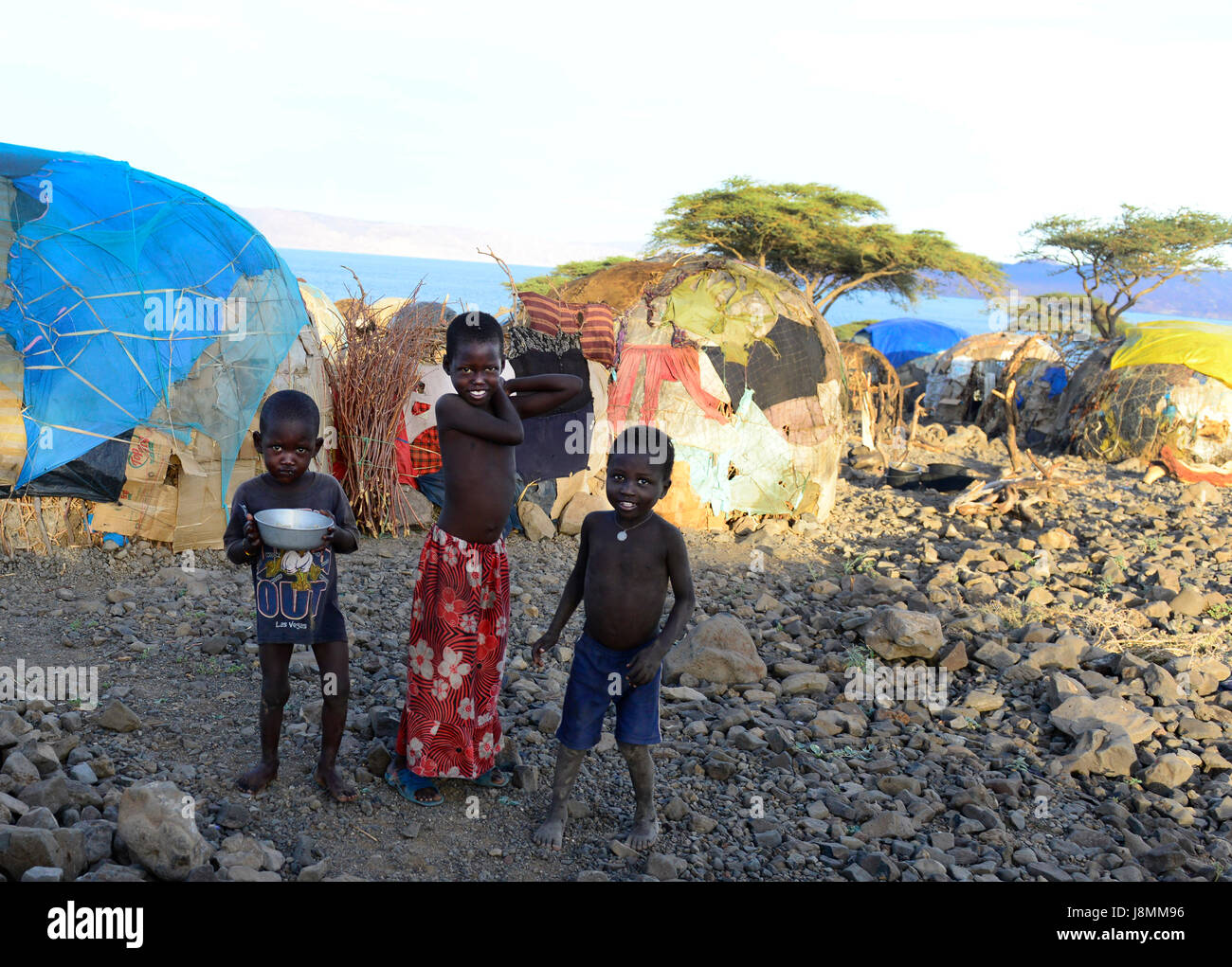 Cute Turkana children in their small village by lake Turkana in Kenya ...