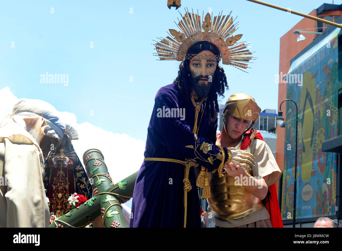 An actor carries a statue of Jesus Christ at the 2014 Good Friday ...