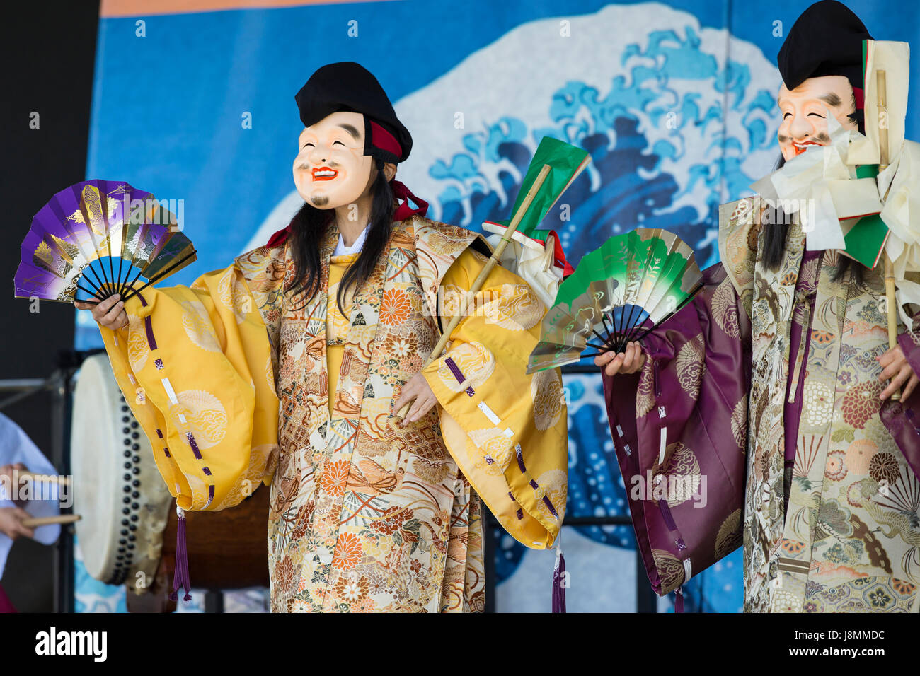Members of TenTen Taiko in traditional Japanese costume and mask ...