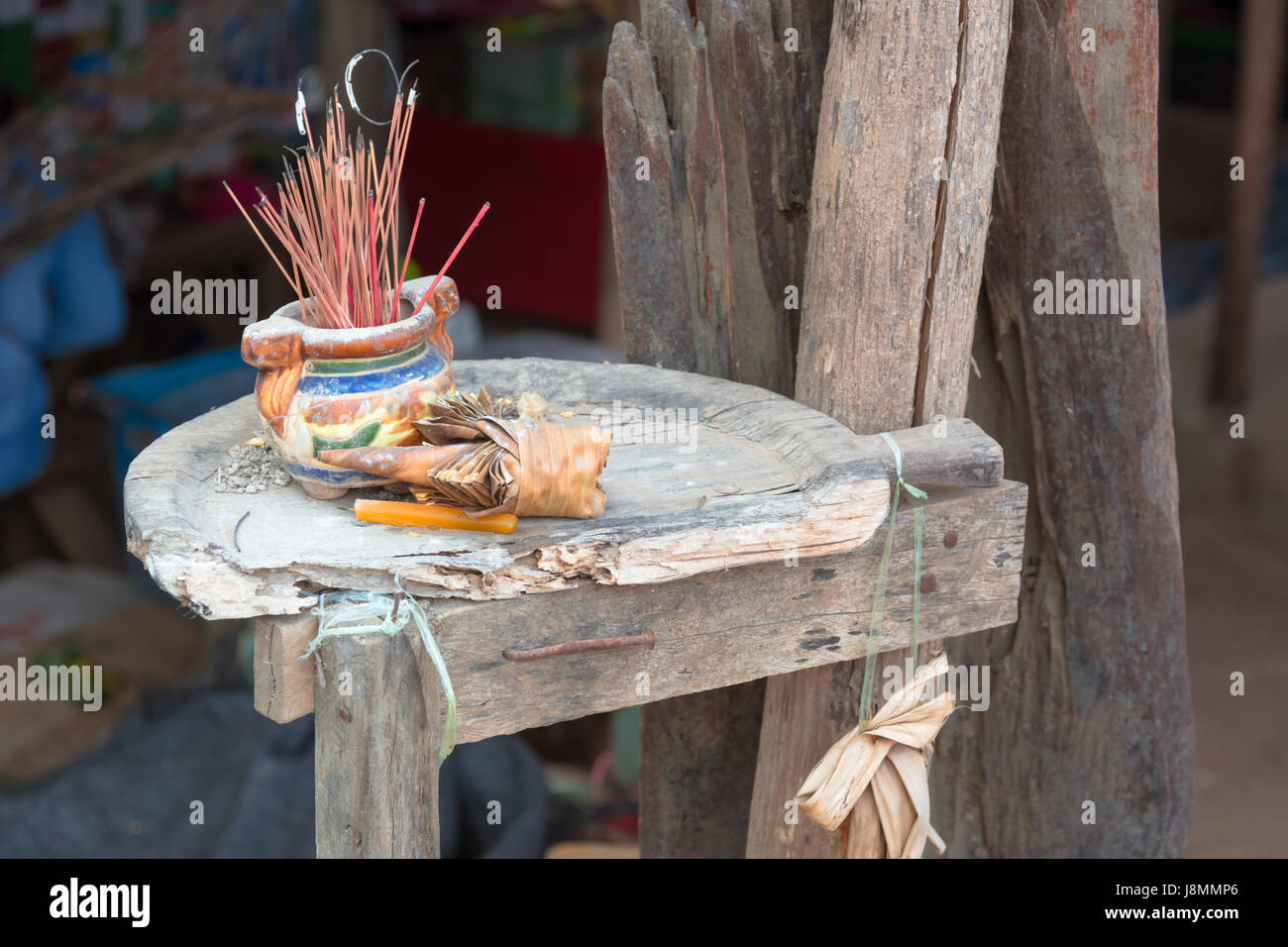 Burned red Incense stick in old joss-stick pot Stock Photo - Alamy