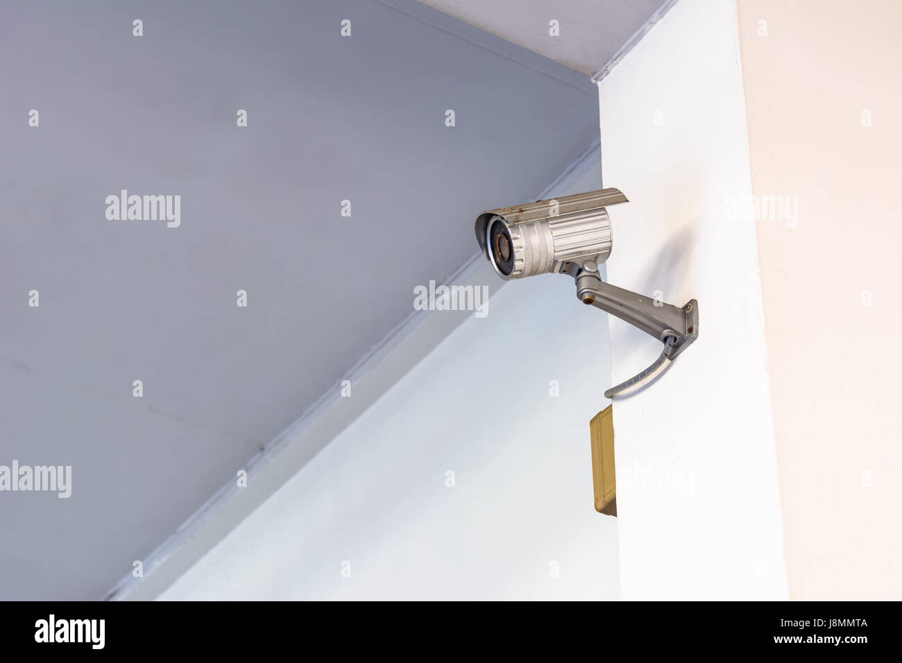 Modern security camera on the indoor concrete wall Stock Photo - Alamy