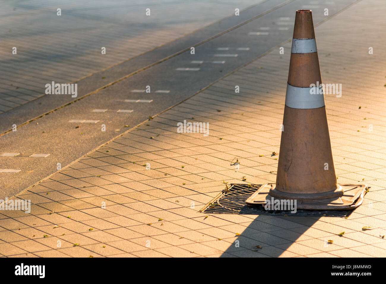 Funnel on tile road background Stock Photo - Alamy
