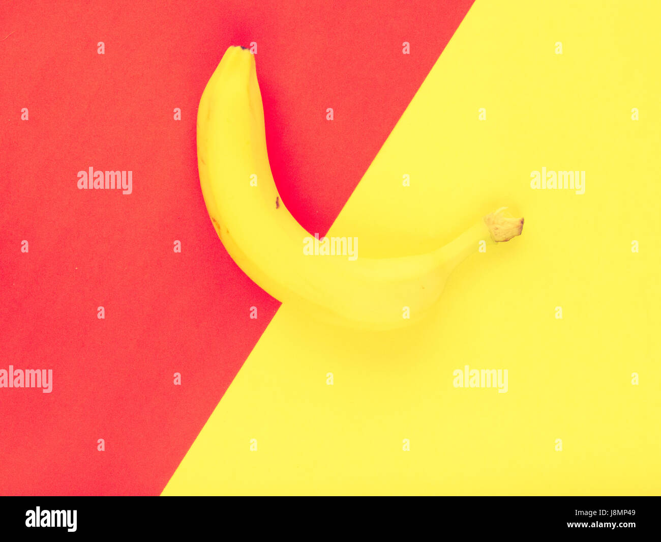Single banana on a colorful pastel background Stock Photo - Alamy