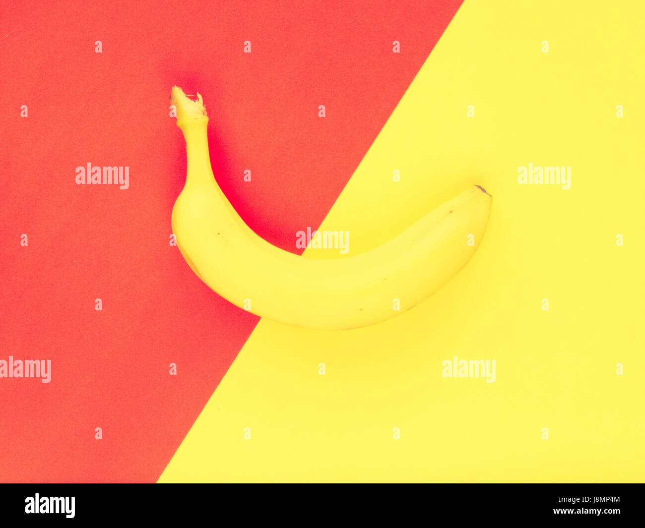 Single banana on a colorful pastel background Stock Photo - Alamy