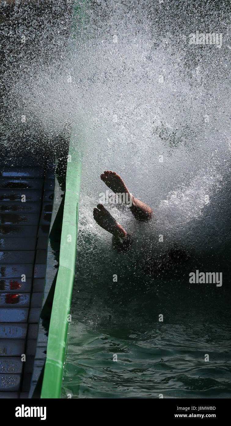 People can be seen swimming in a pool adjecent to the river Lech in ...