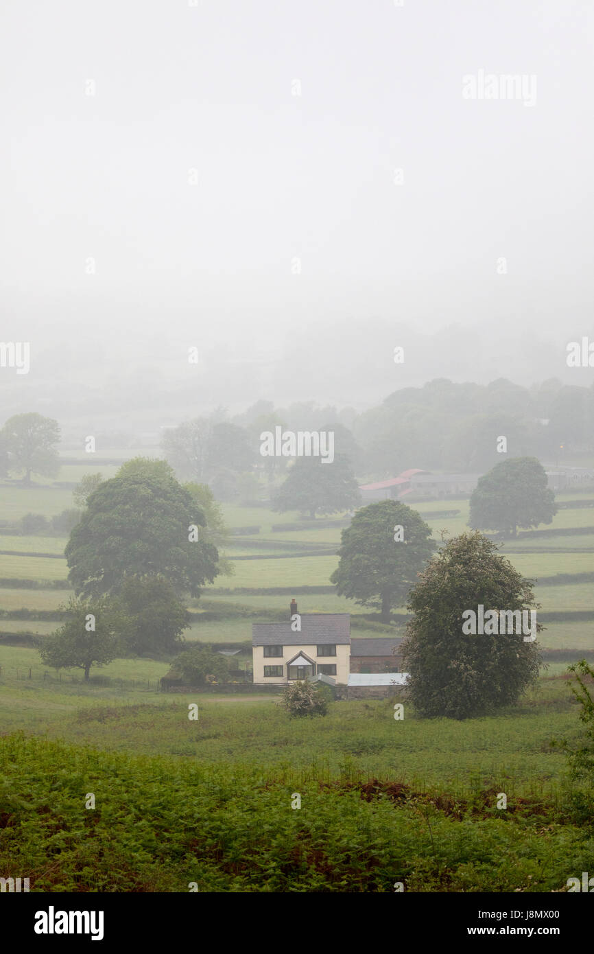 Rain begins to fall over a rural Welsh Landscape and the cottage Tan-y ...