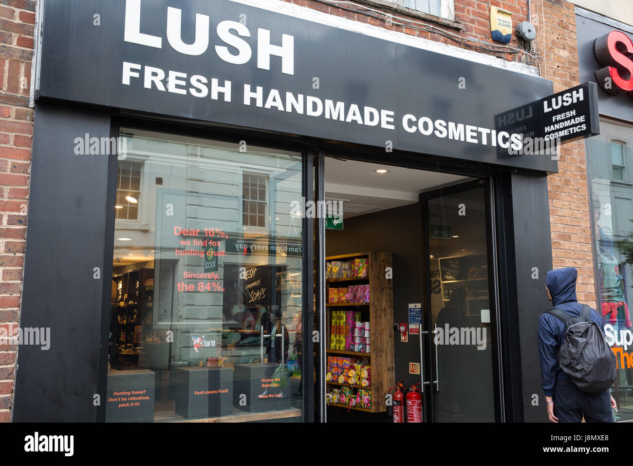 Windsor, UK. A screen and props inside the window of a Lush store are ...