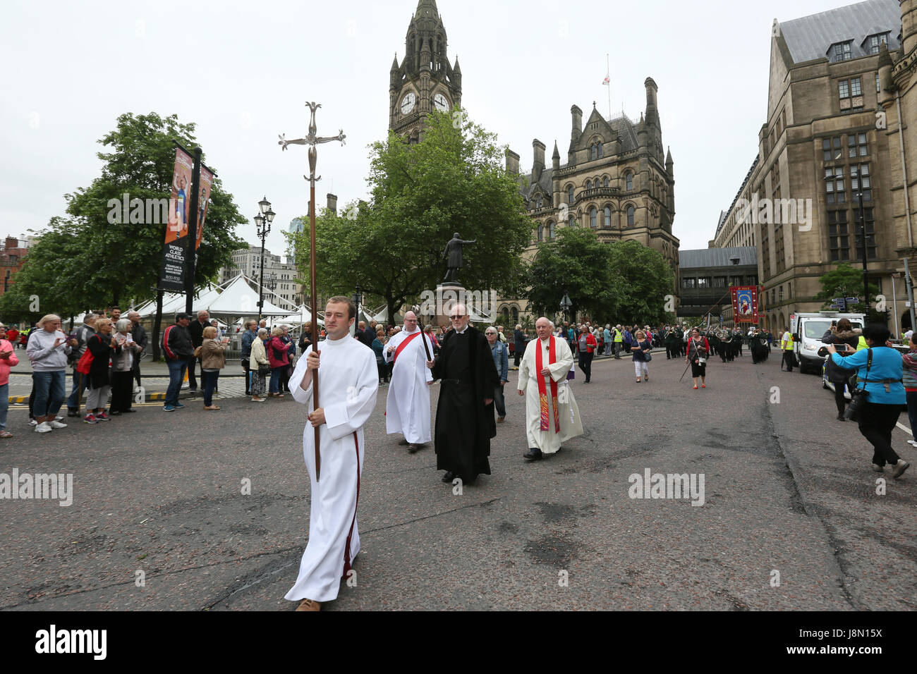 Manchester, UK. 29th May, 2017. Whit walk procession passes in front of ...