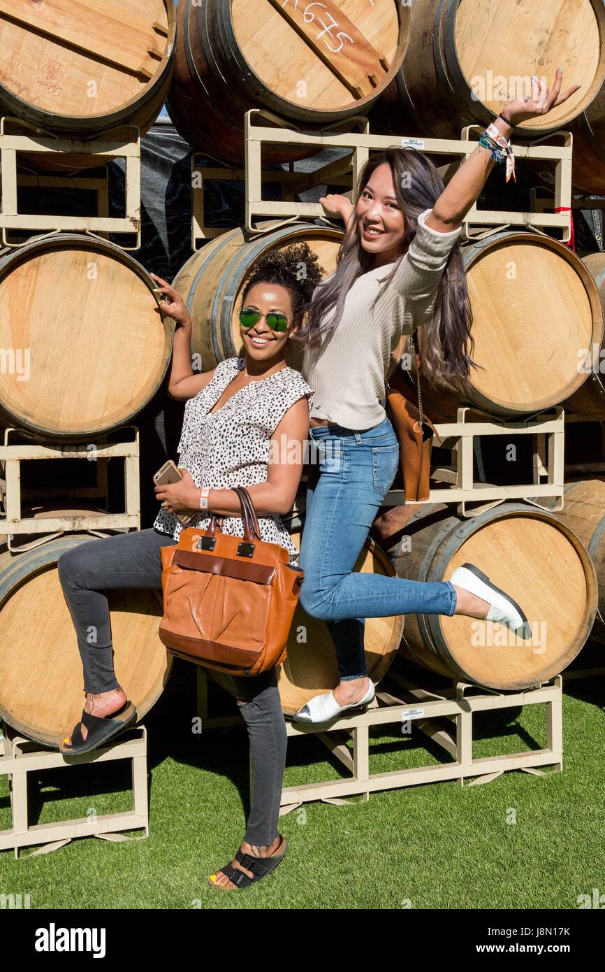 Napa, California, USA. 28th May, 2017. Two female music fans hang from ...