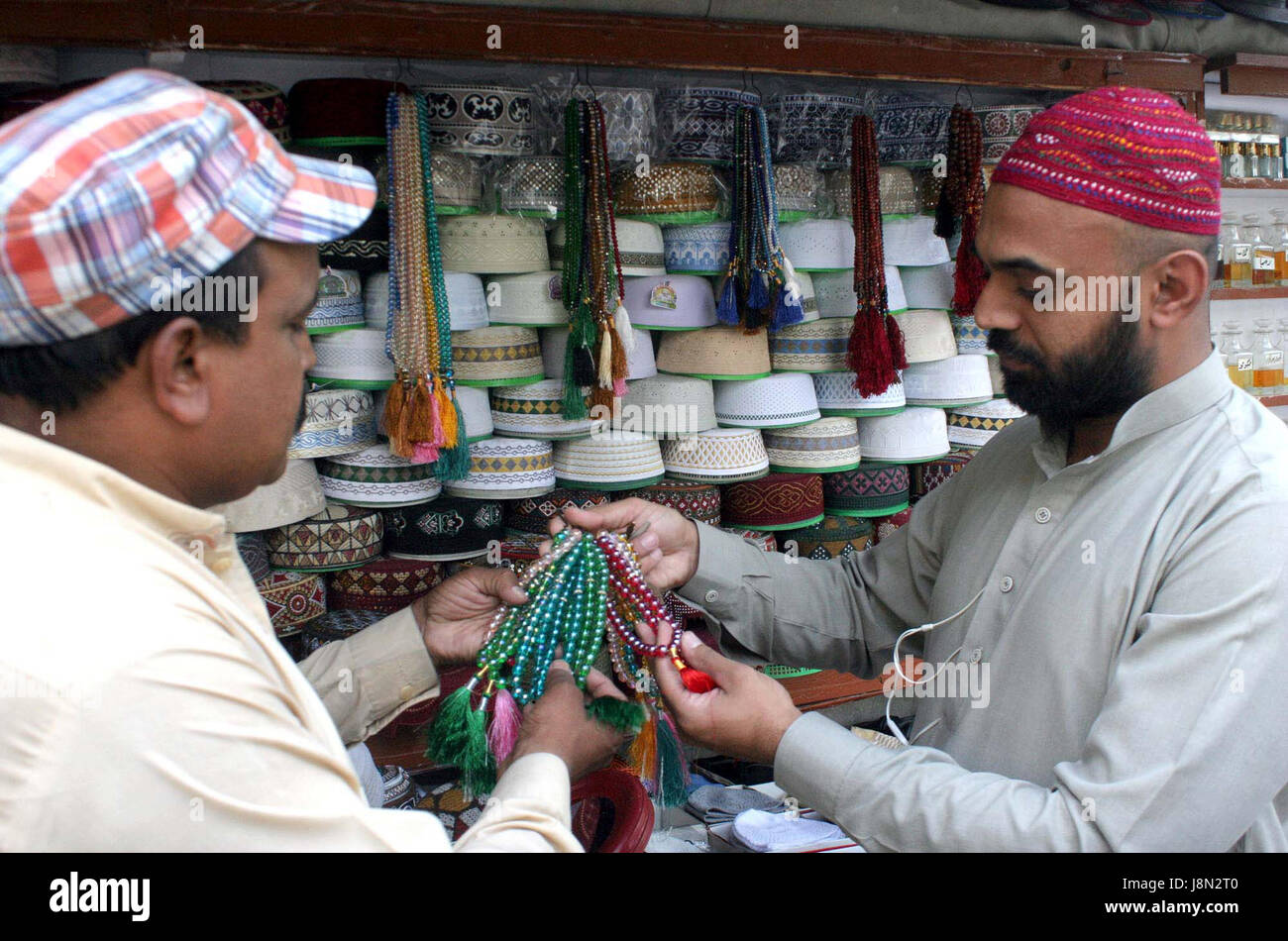 Caps and prayer beads hi-res stock photography and images - Alamy
