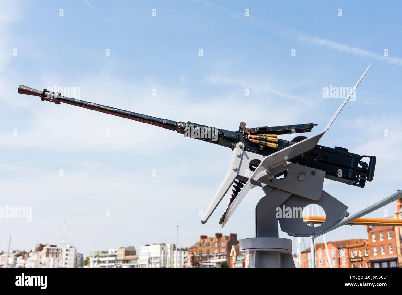Side view of 50 calibre Browning machine gun turret against the sky ...
