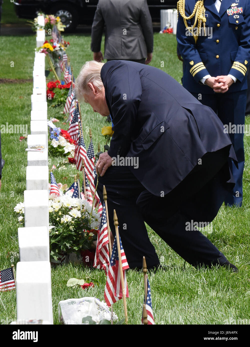 United States President Donald J. Trump walks through Section 60 after ...