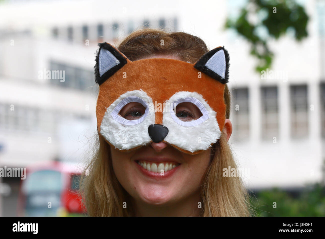 London, UK. 29th May, 2017. A protestor wearing a foxy face mask ...