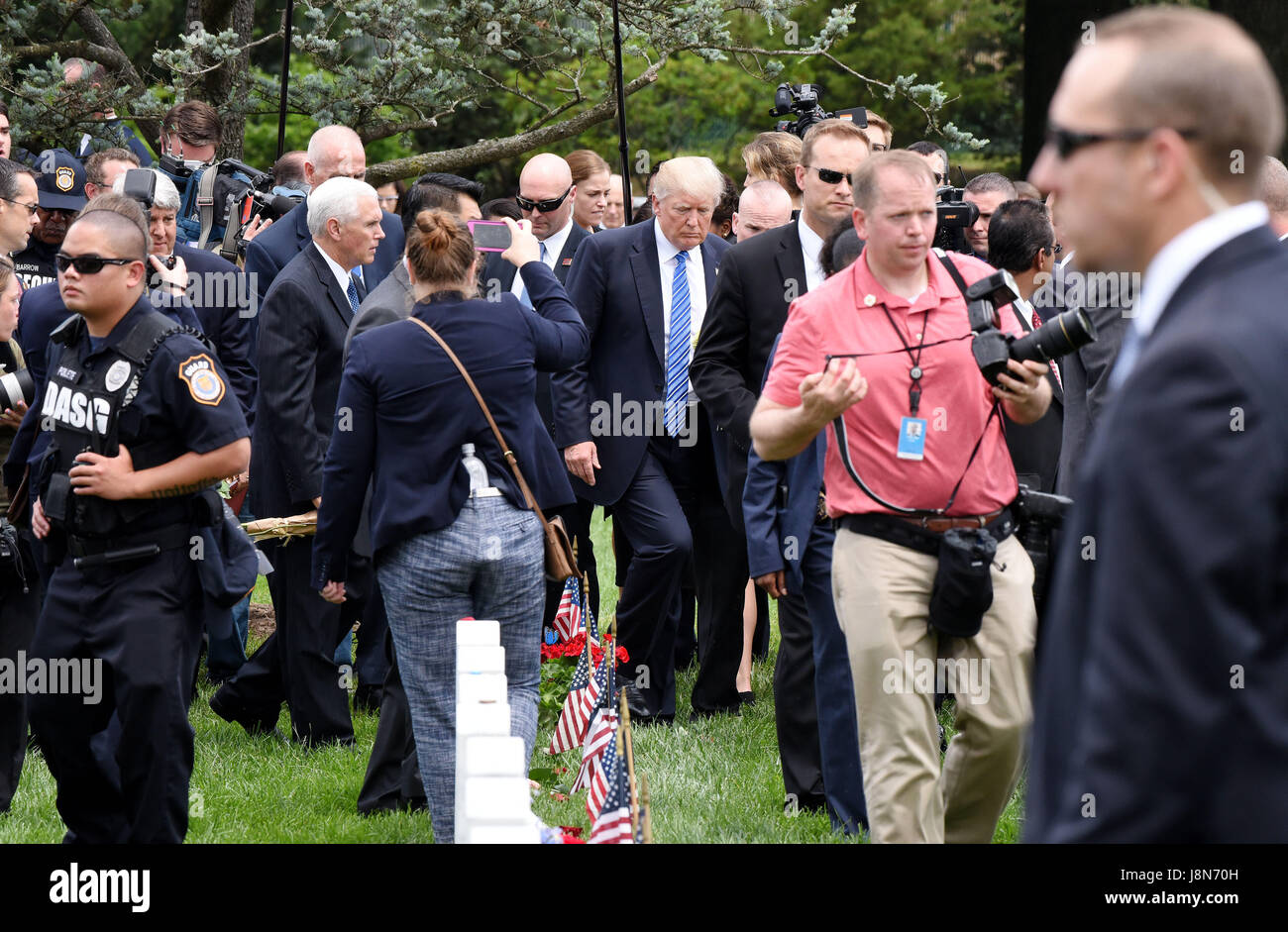 United States President Donald J. Trump walks through Section 60 after ...