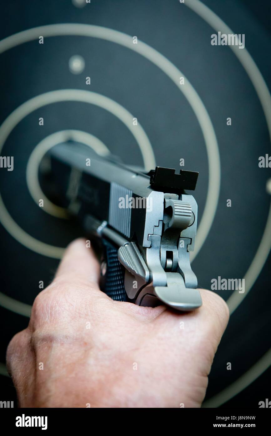 Koeln, Germany. 30th Apr, 2017. Colt Pistol aimed at a target, in April ...