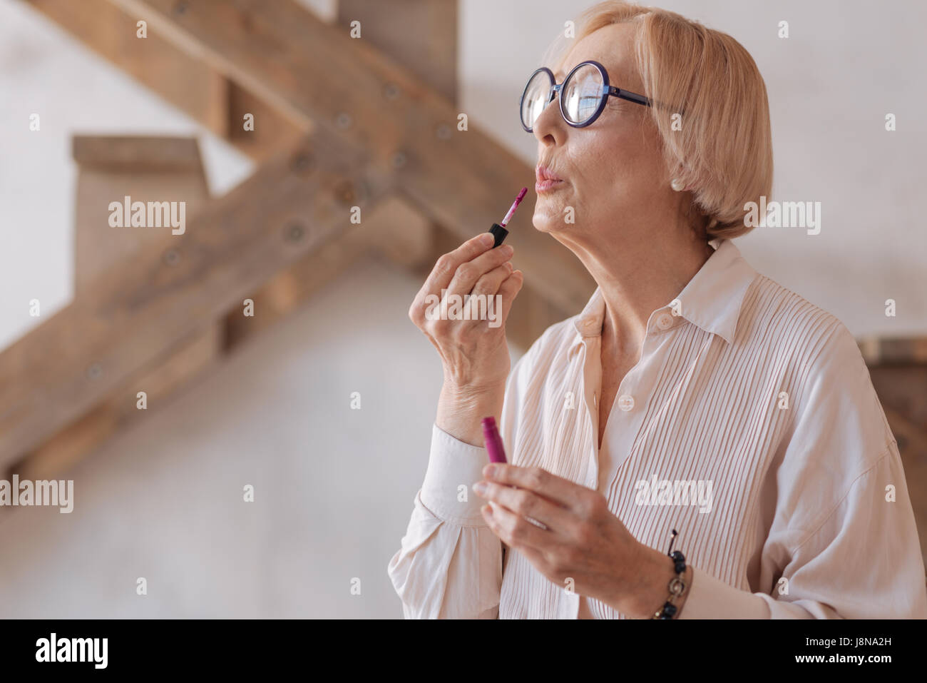 Pressing lips. Profile photo of mature woman that pressing lips while ...