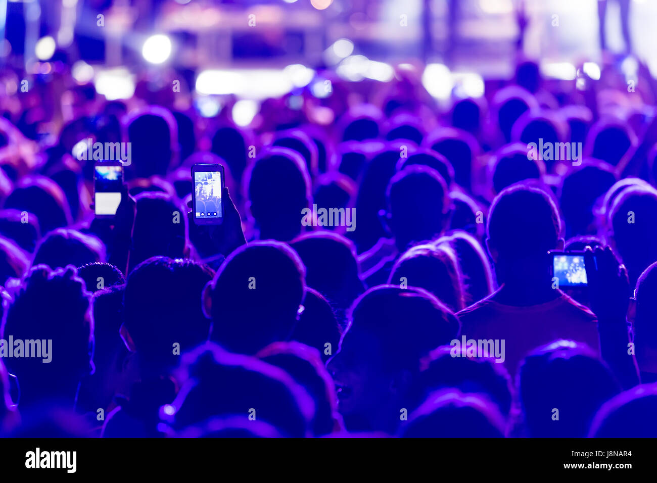 Hand with a smartphone records live music festival, Taking photo of ...