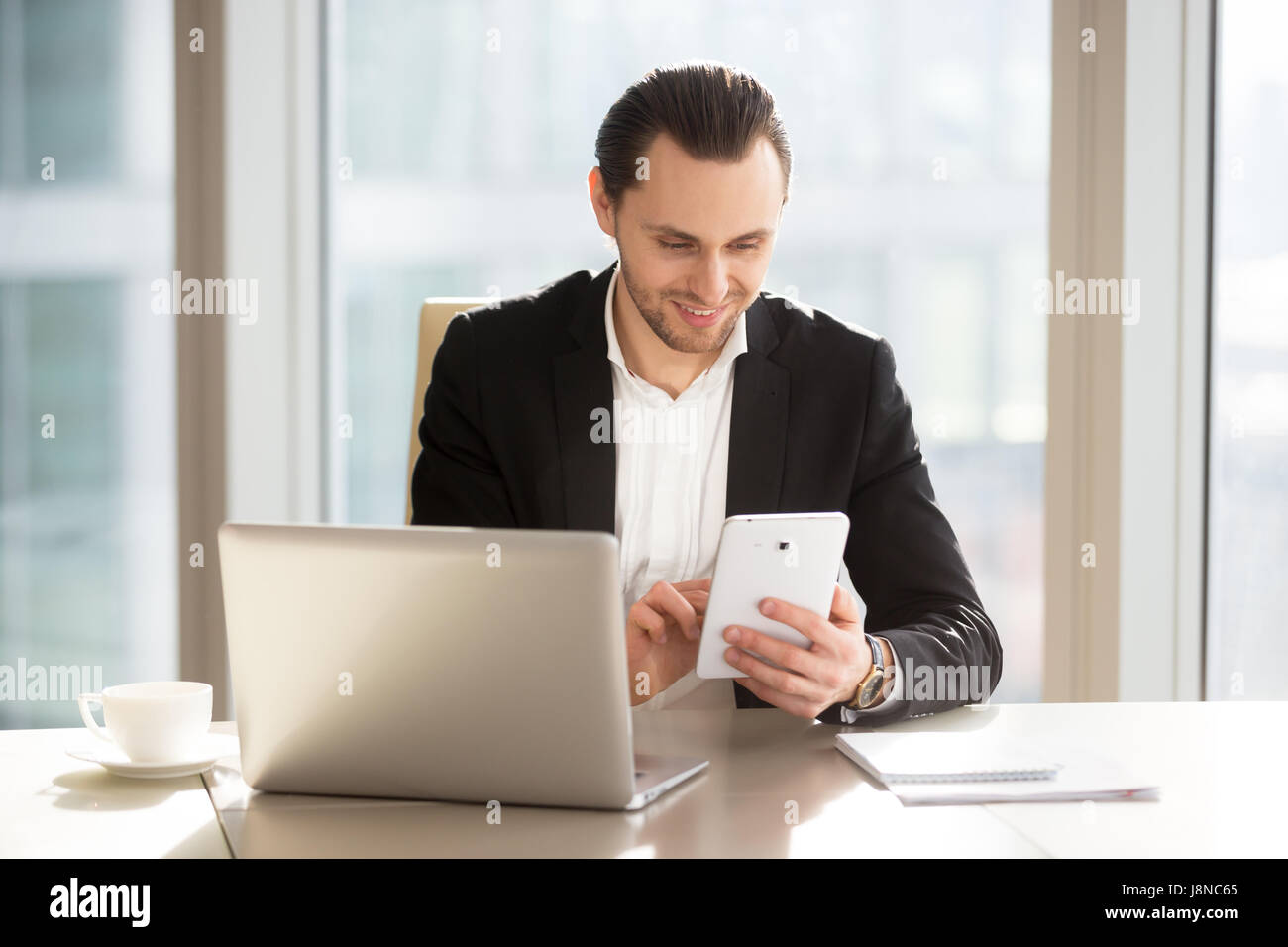 Executive manager using mobile app for banking Stock Photo - Alamy