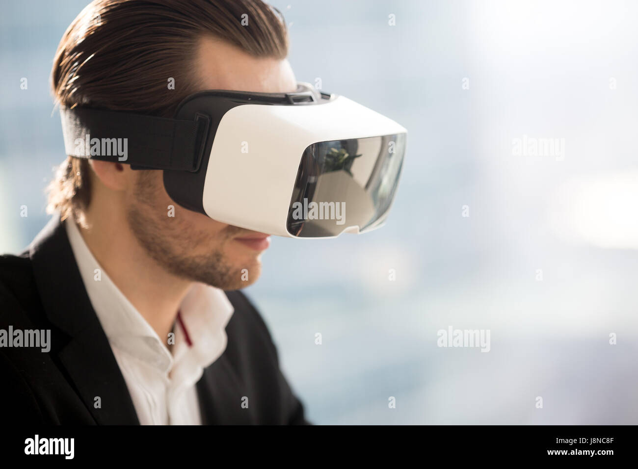 Close up photo of VR headset on mans head Stock Photo - Alamy