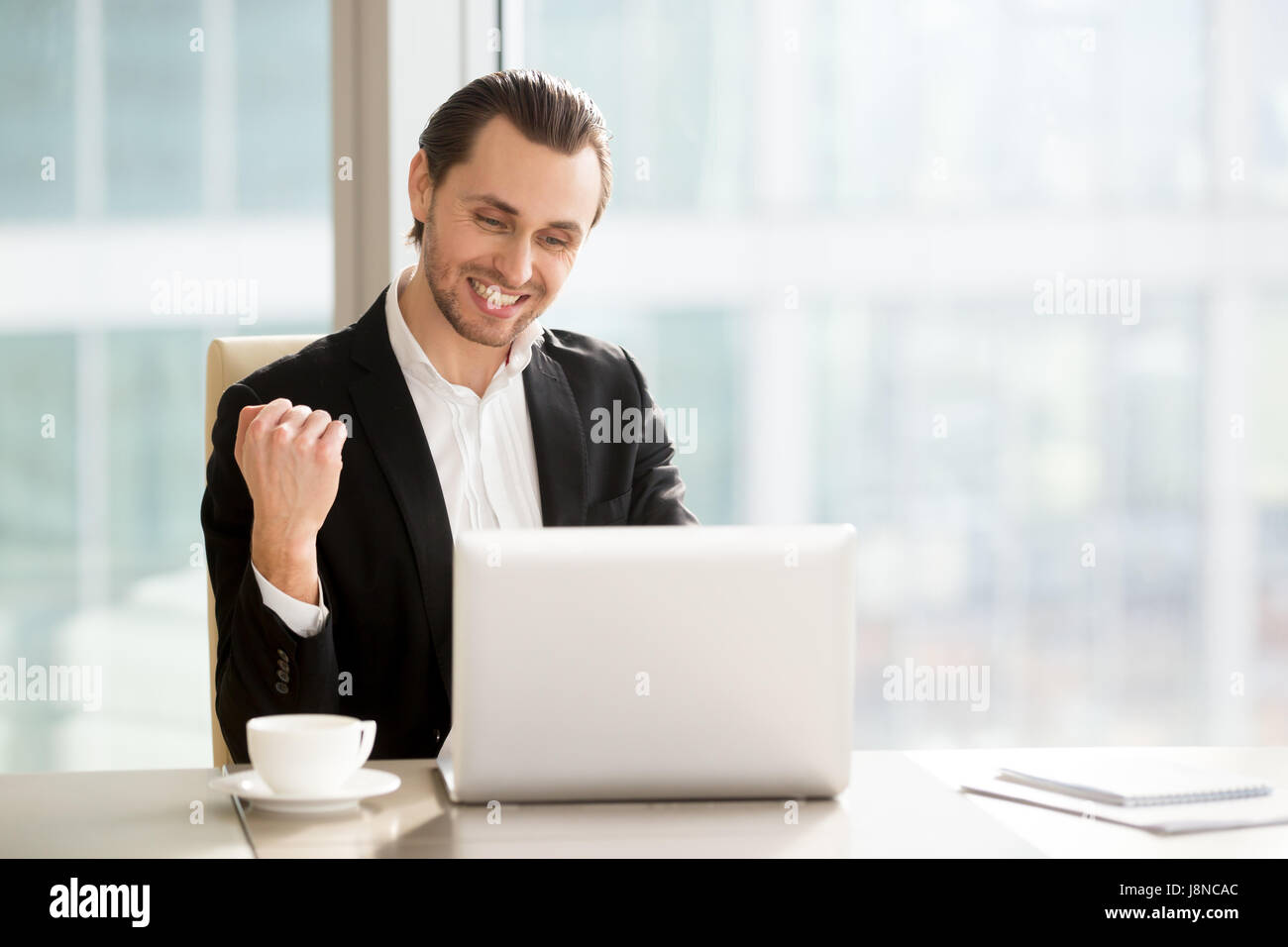 Happy successful businessman celebrating hi-res stock photography and ...