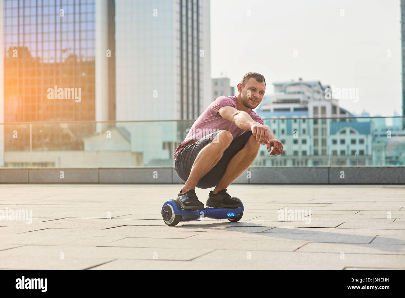 Young male riding hoverboard Stock Photo - Alamy