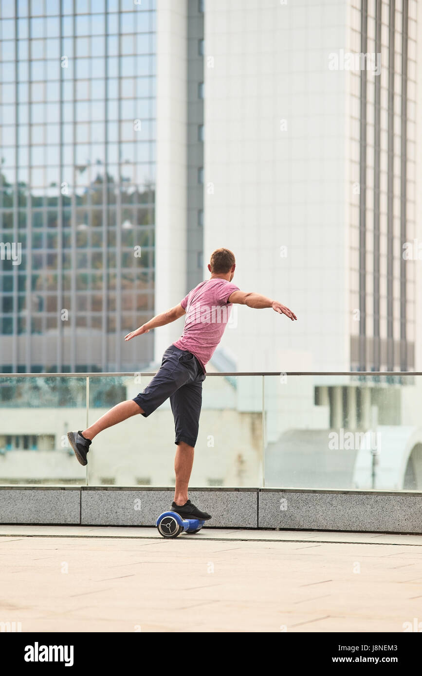 Man on hoverboard, flying pose Stock Photo - Alamy