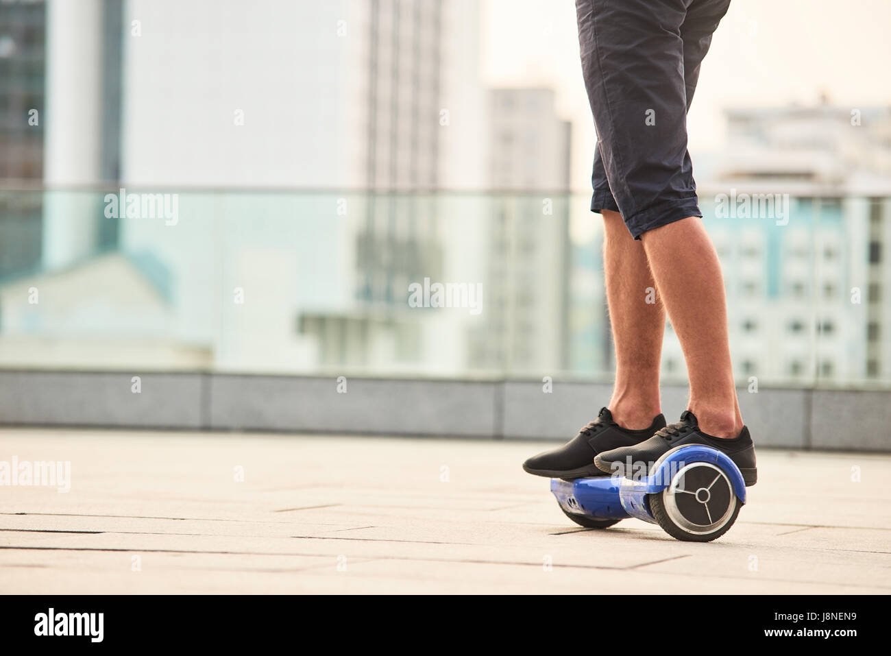 Legs of man riding gyroboard Stock Photo - Alamy