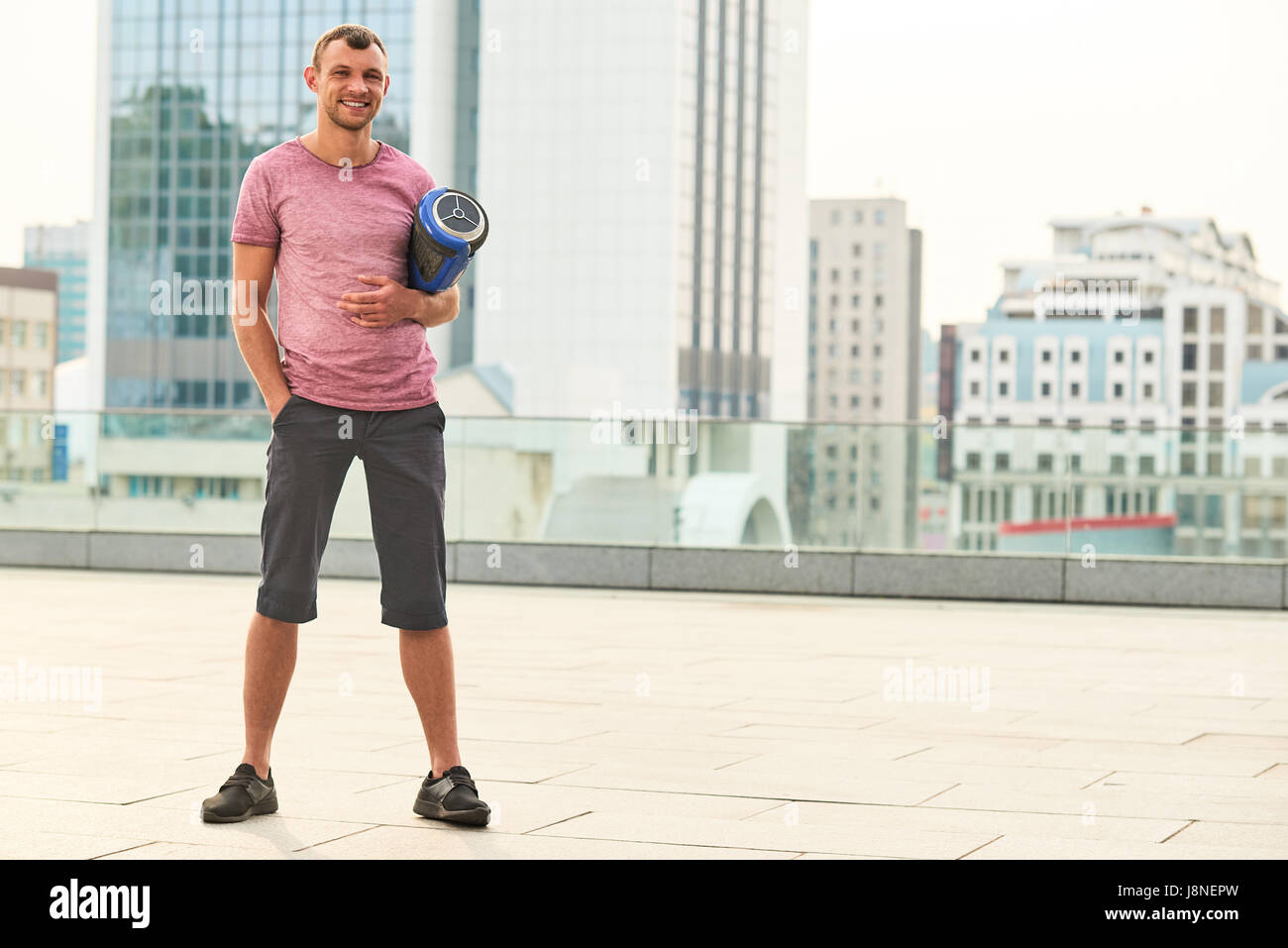 Man holding gyroboard and smiling Stock Photo - Alamy
