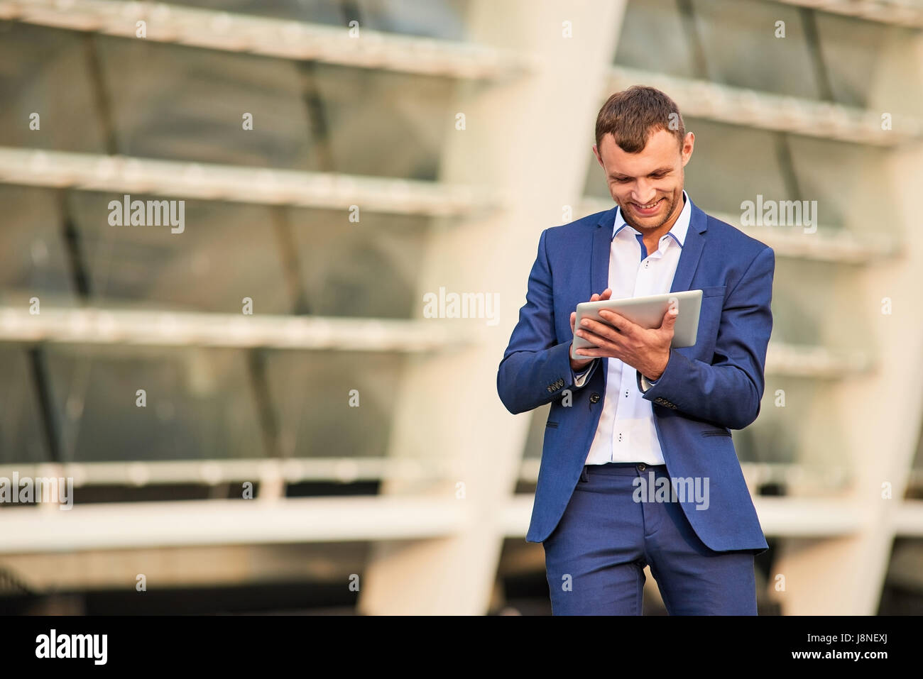 Businessman using tablet Stock Photo - Alamy