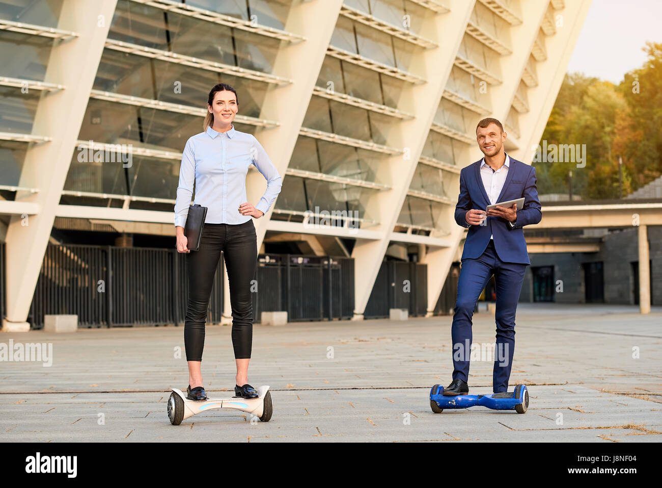 Business people on hoverboards Stock Photo - Alamy