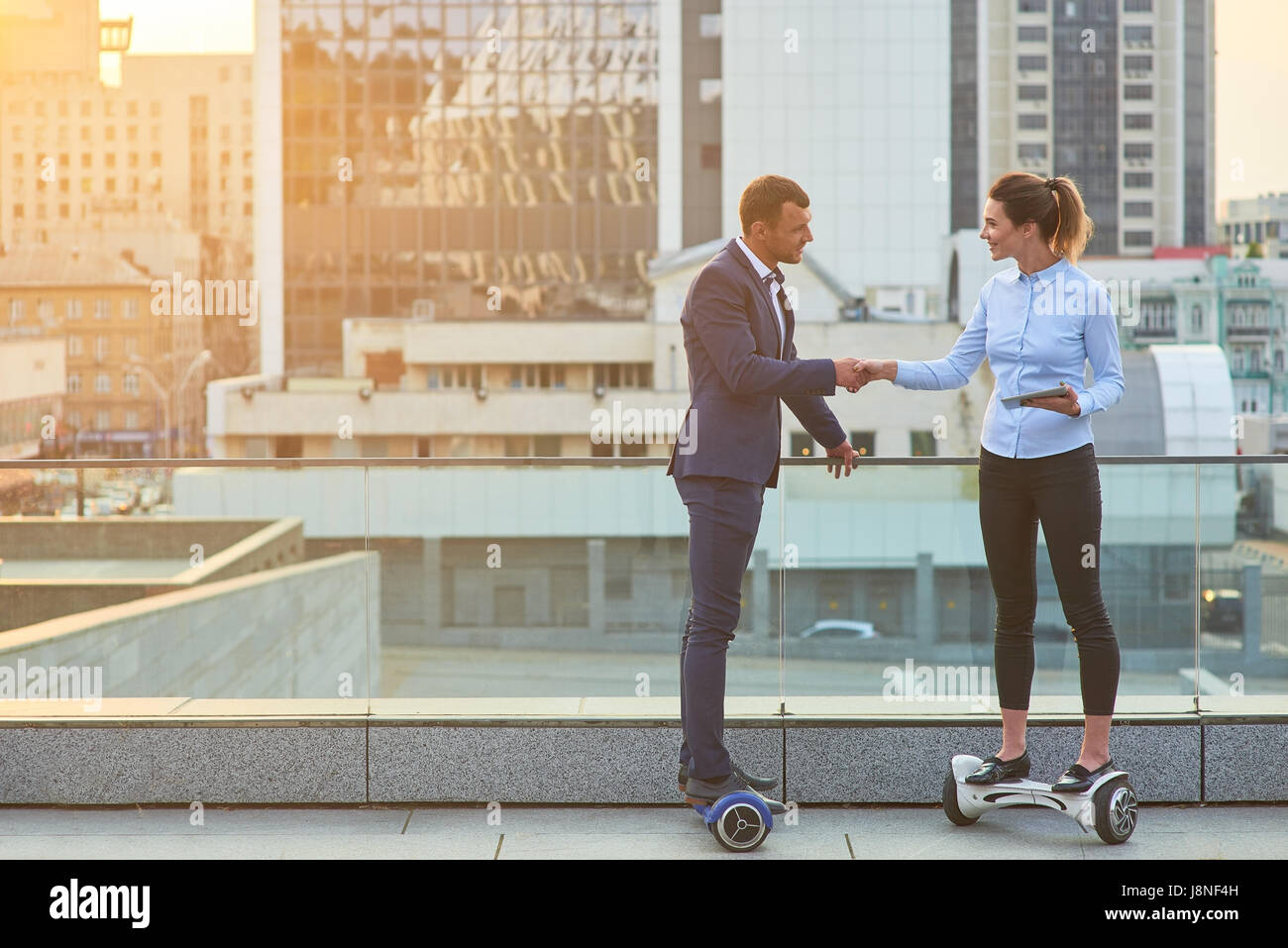 Woman and businessman shaking hands Stock Photo - Alamy
