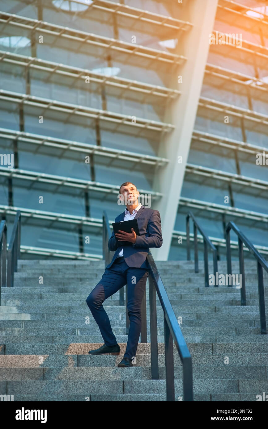Businessman holding clipboard Stock Photo - Alamy Businessman holding clipboard Stock Photo - Alamy