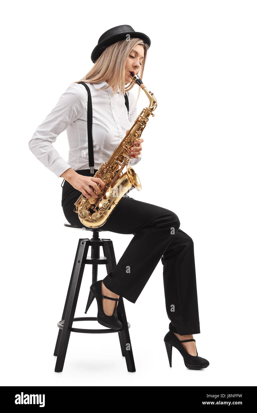 Female jazz musician seated on a chair playing a saxophone isolated on ...