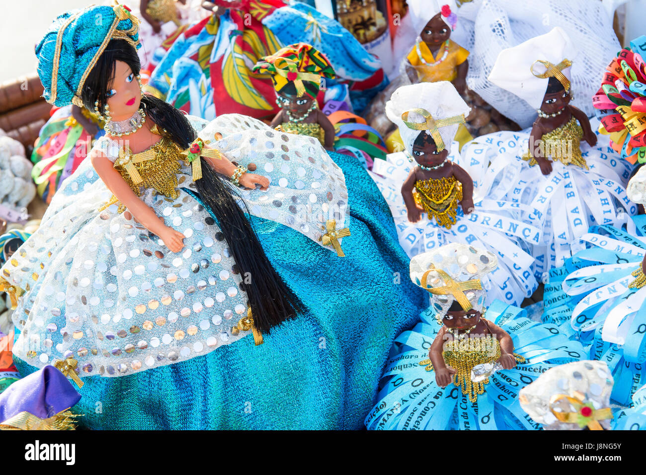 Souvenir figurines of the Yoruba goddess Yemanja stand on display at ...
