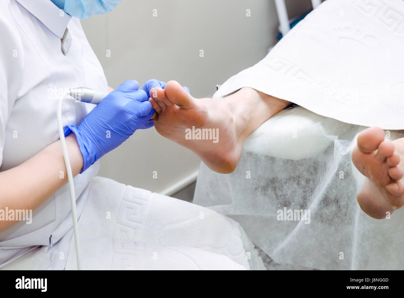 Master chiropody shapes the nails . Male patient in the process of ...