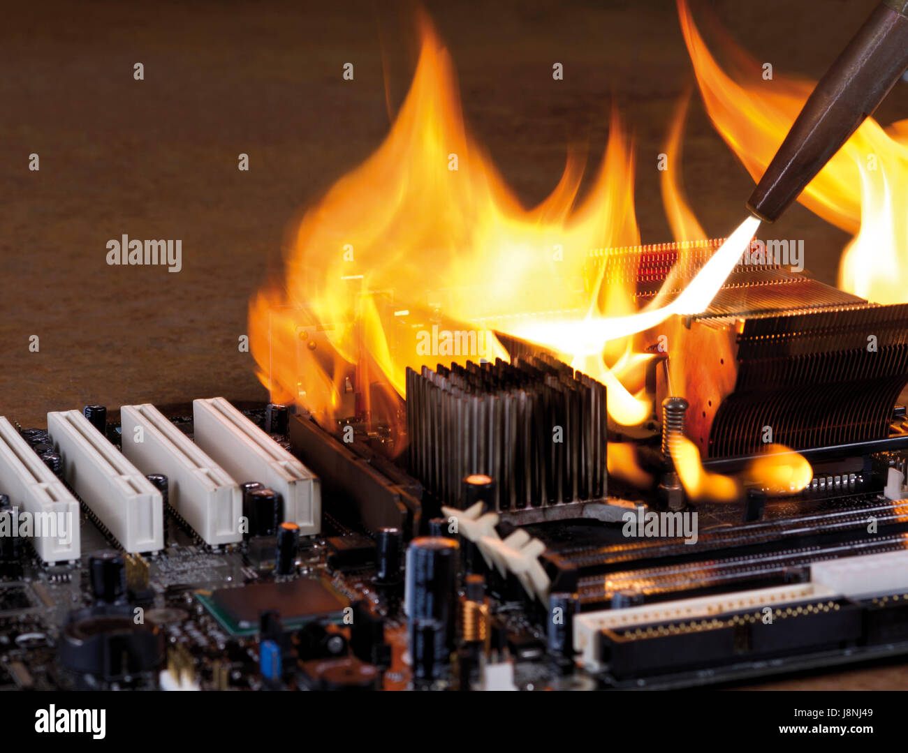 burning computer mainboard Stock Photo - Alamy
