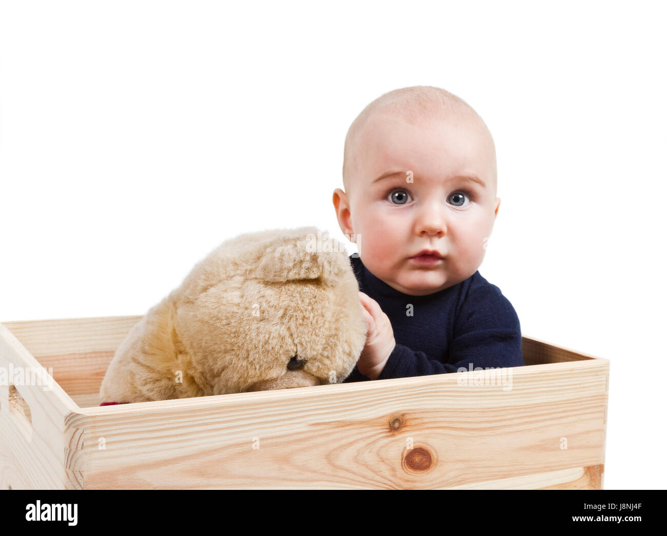 young child with toy in wooden box Stock Photo - Alamy
