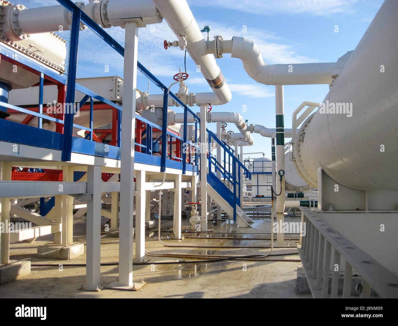 Heat exchangers in a refinery. The equipment for oil refining.Heated ...