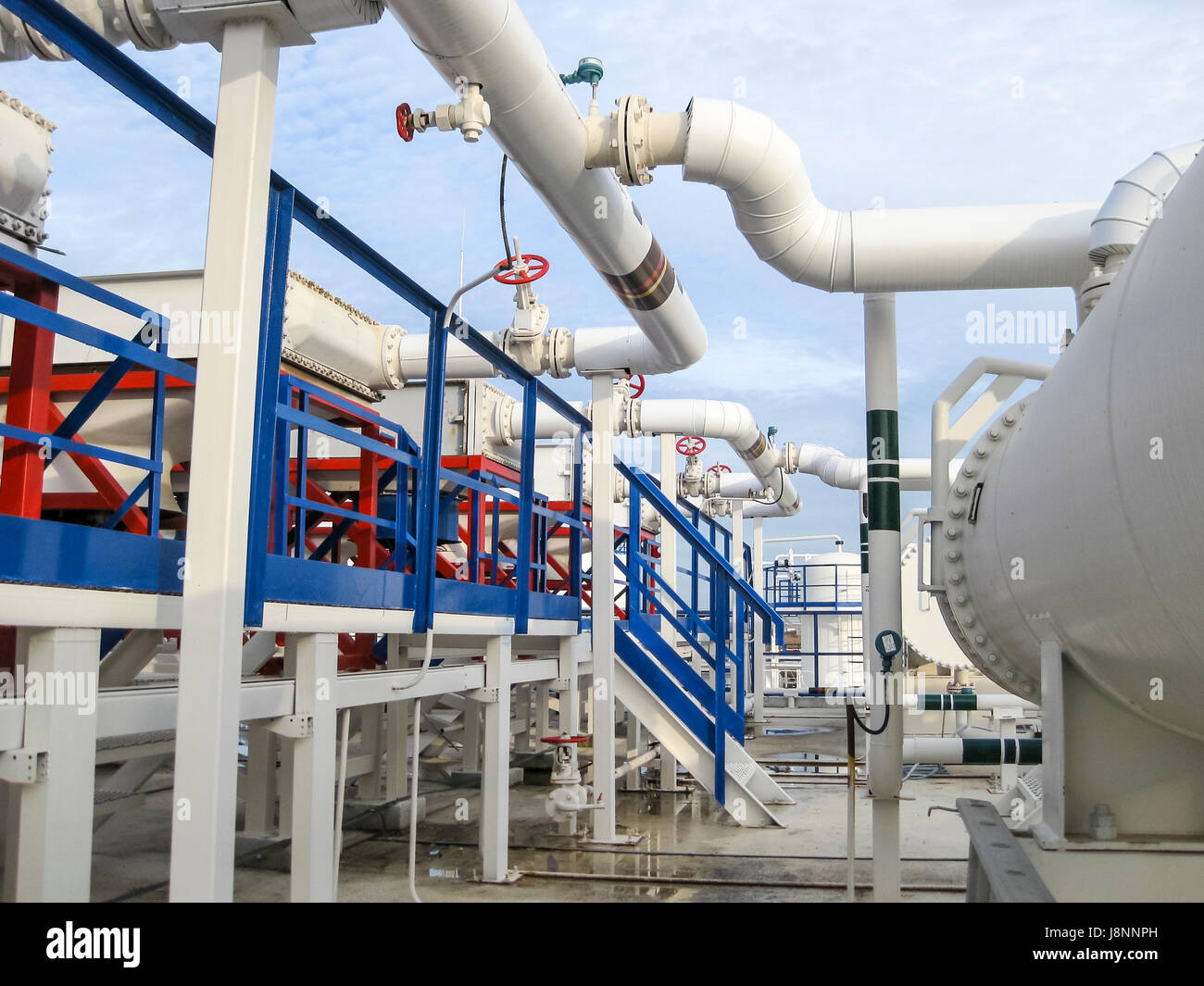 Heat exchangers in a refinery. The equipment for oil refining.Heated ...