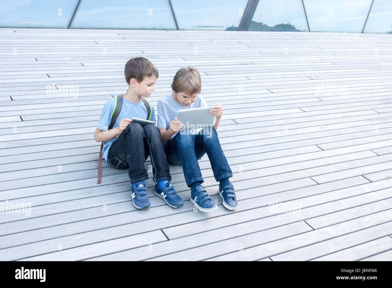Children with tablet computers outdoor. People education learning ...